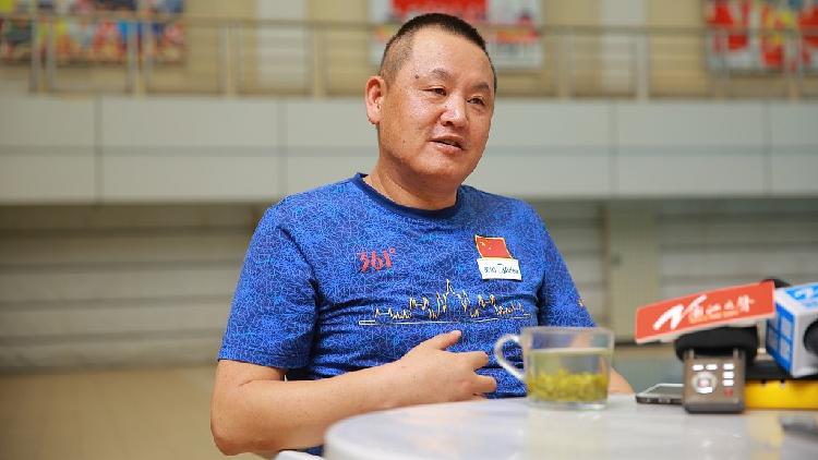 China's 'champion swimming coach' Xu Guoyi dies at 50 - CGTN