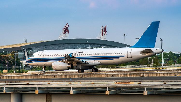 Wuhan welcomes first international passenger flight in 8 months - CGTN