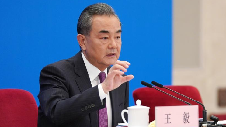 Wang Yi backs improving HK electoral system, urges U.S. reset - CGTN