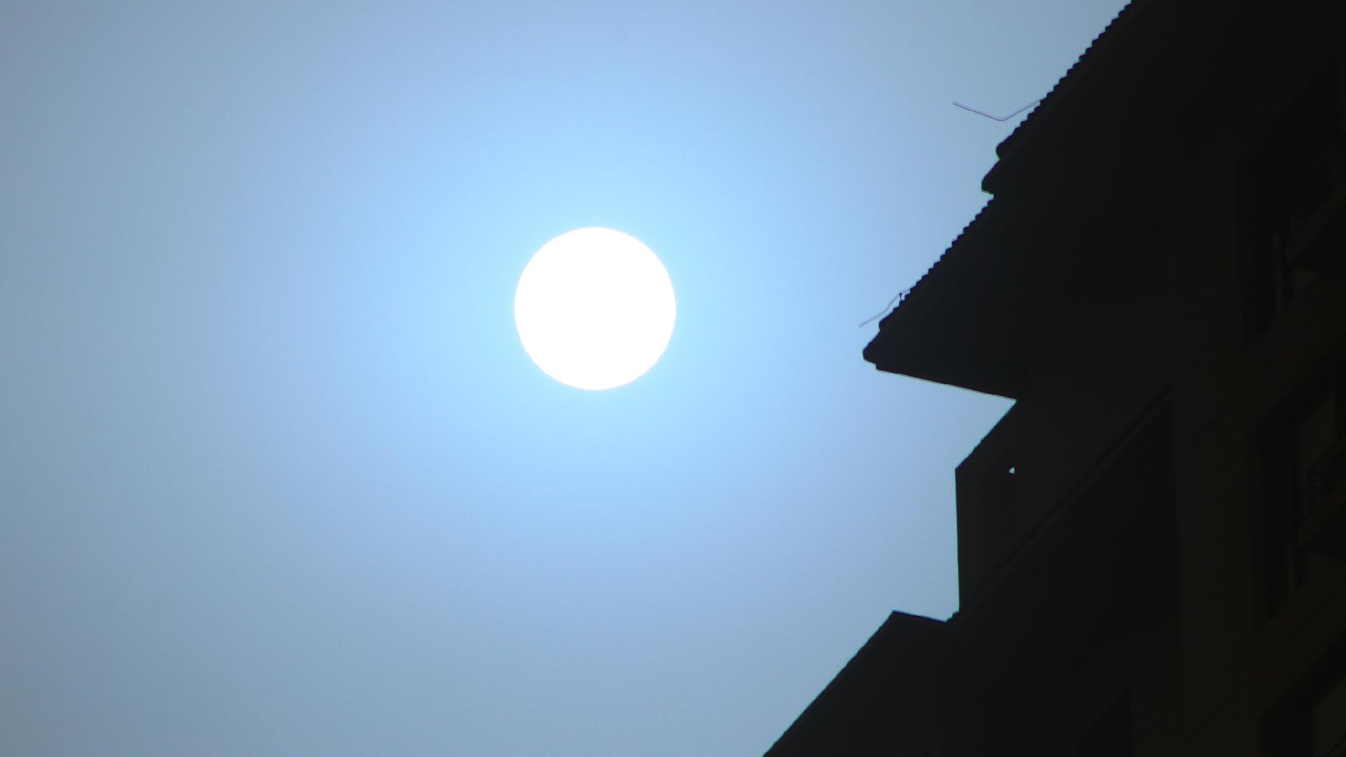 'Blue sun' appears in China's capital Beijing as sand dust sweeps in - CGTN