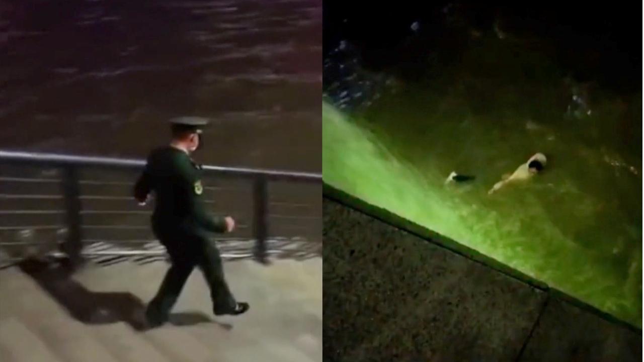 Police officer jumps into river in E China to save drowning woman - CGTN