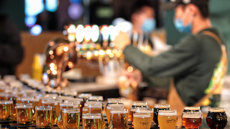 Century-old Tsingtao Beer hits the new national tide to revive brand - CGTN