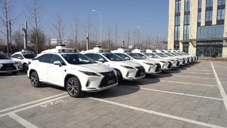 China launches first commercial pilot of self-driving services - CGTN