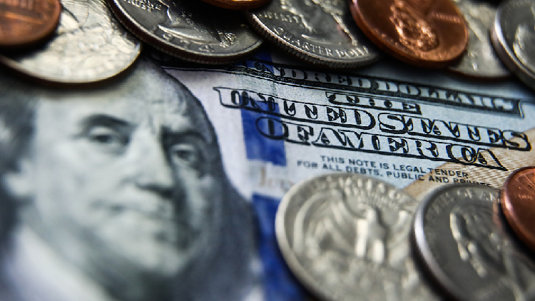 Dollar hits 1-month high as Fed officials talk up rate hikes - CGTN