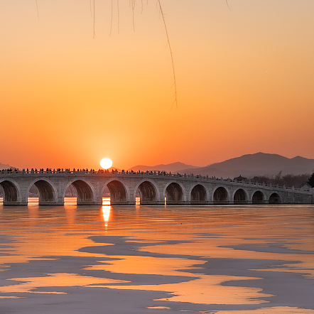 Live: Seventeen-arch Bridge lights up at sunset in Summer Palace - CGTN