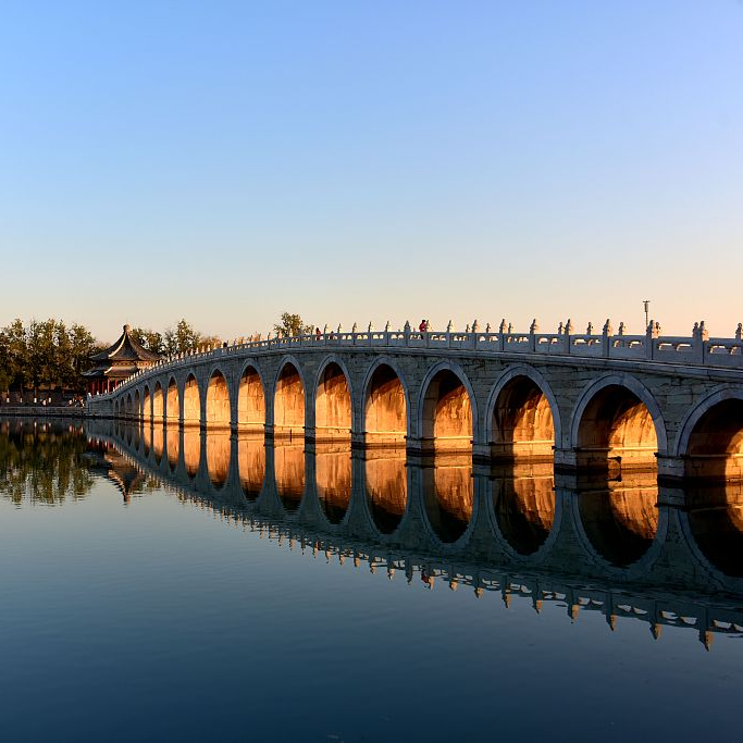 Live: Seventeen-arch Bridge lights up at sunset in Summer Palace - CGTN