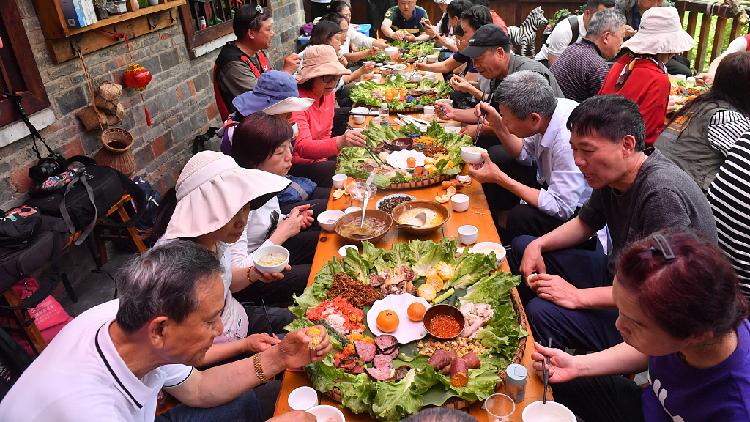 Ethnic Miao cuisine gets visitors into 'Sisters Festival' spirit - CGTN