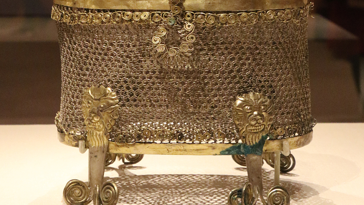 Tang Dynasty tea set: a gilded silver openwork cage - CGTN