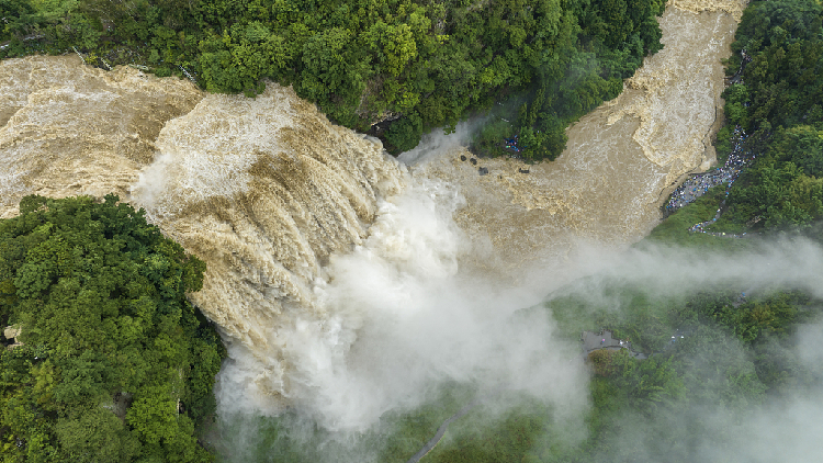 Record-breaking water surge at Huangguoshu Waterfall - CGTN