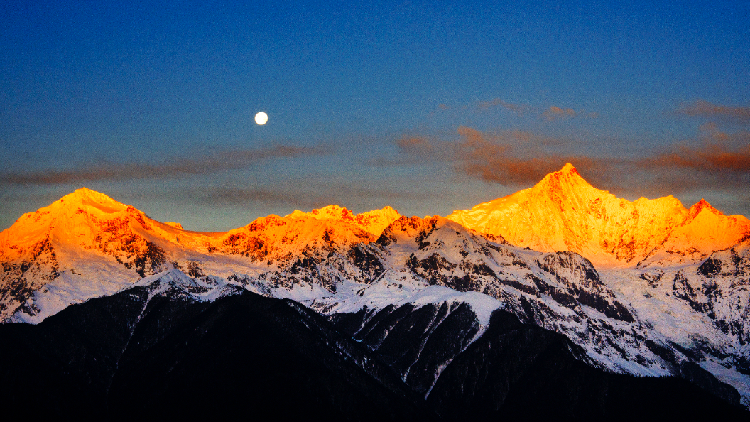 Golden glow on Meili Snow Mountains - CGTN