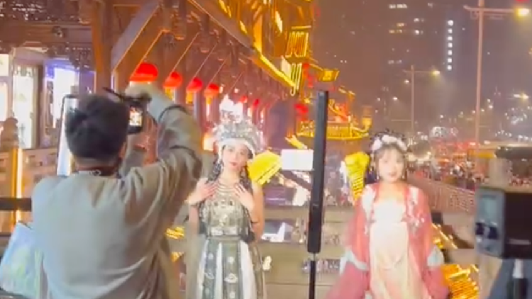 Hanging out at Hongya Cave in Miao costume - CGTN