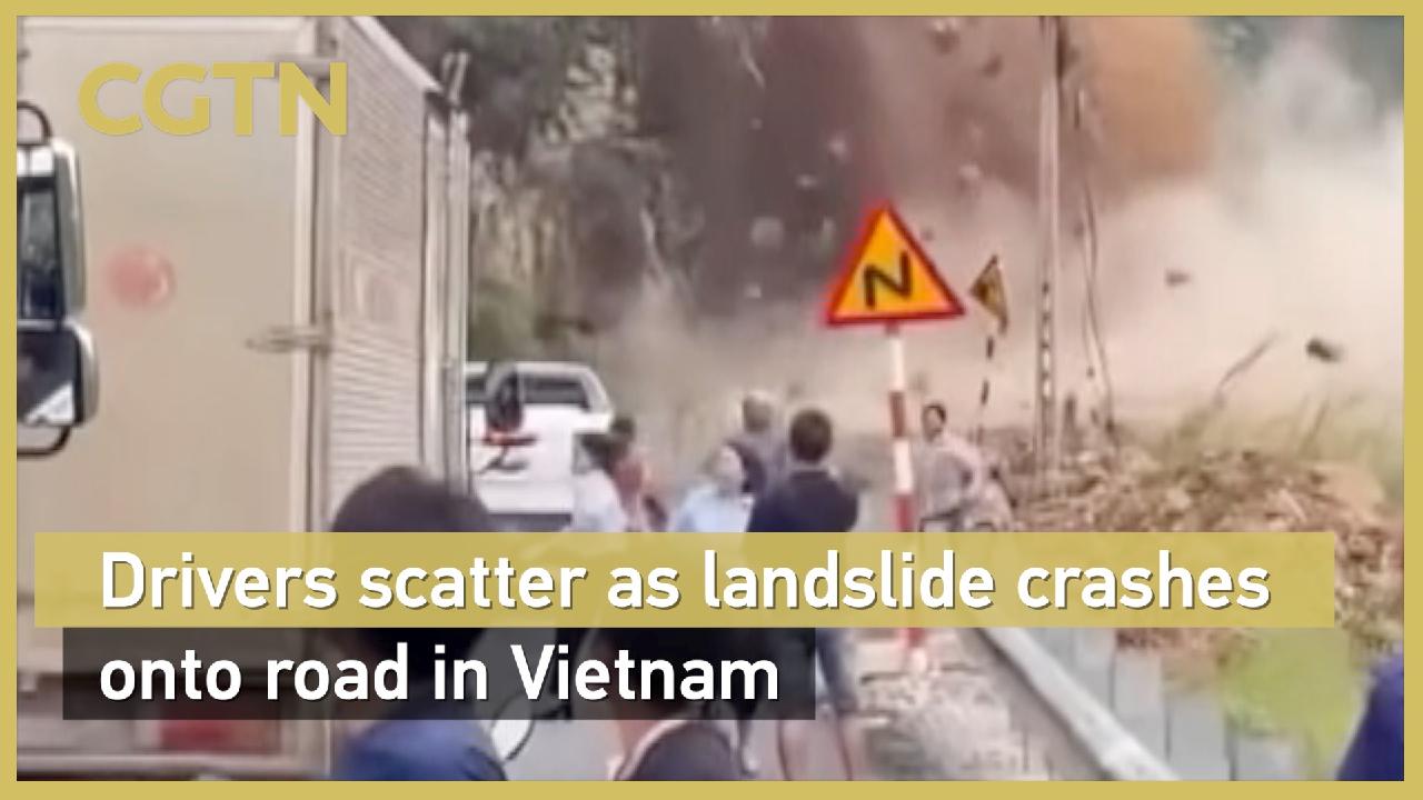 Drivers scatter as landslide crashes onto road in Vietnam - CGTN
