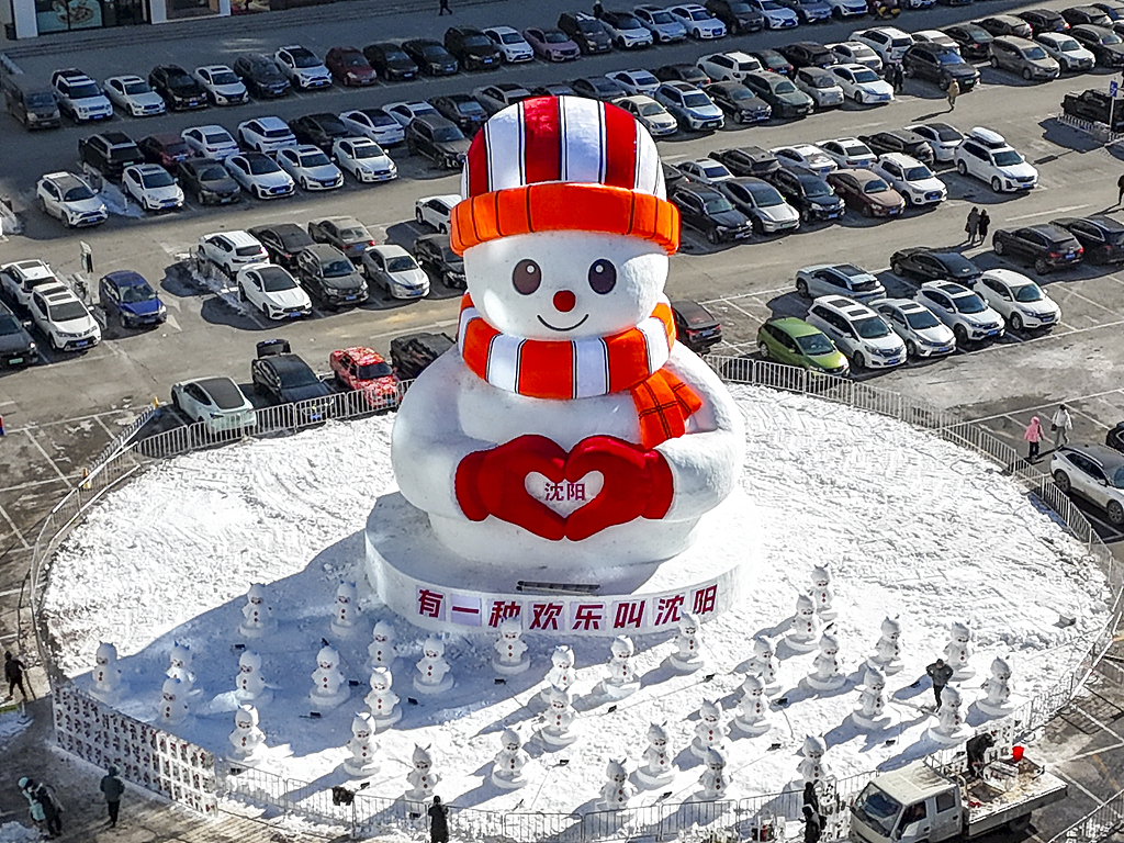 Smiling 16-meter-tall snowman brings warmth to northeast China - CGTN