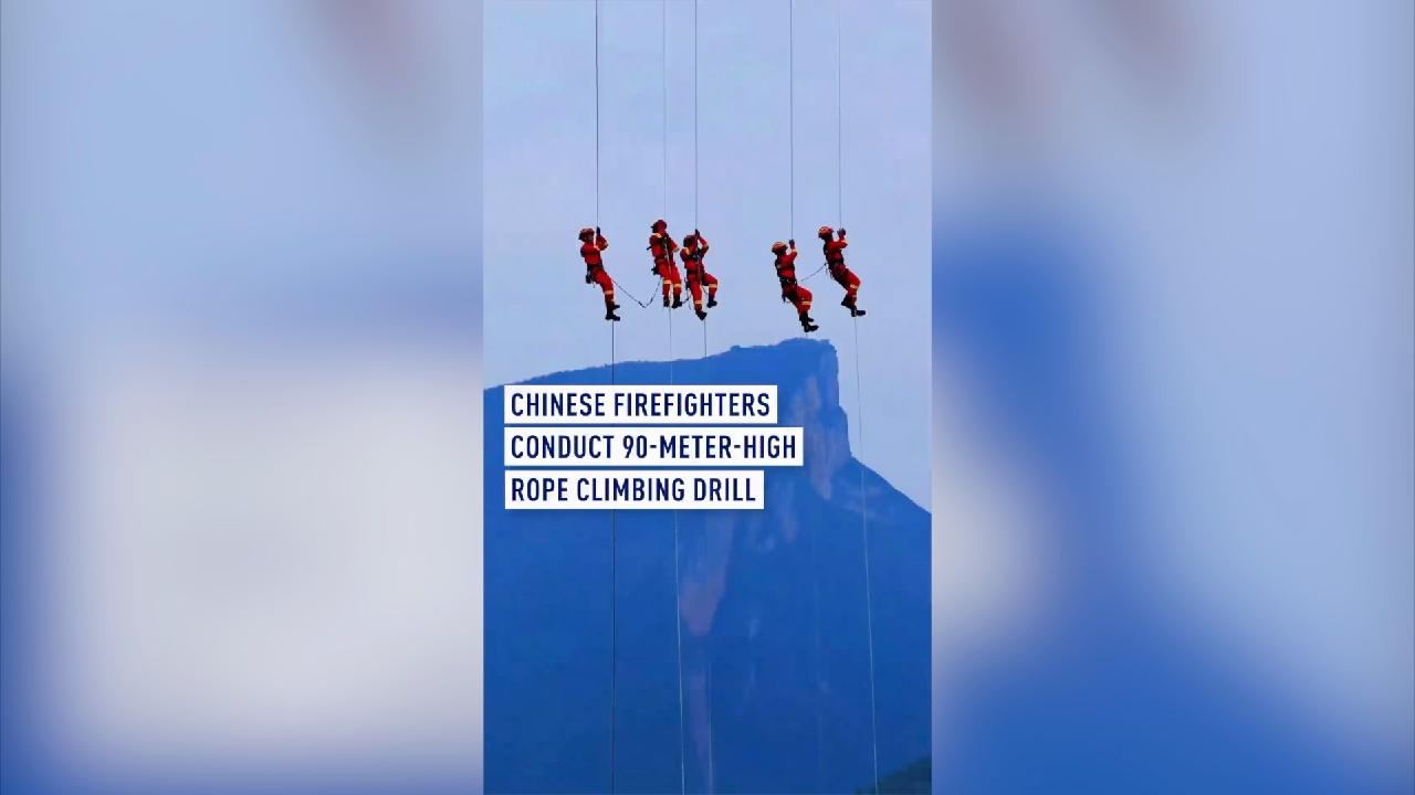 Chinese firefighters conduct 90-meter-high rope climbing drill - CGTN
