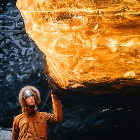 Glacier's golden glow in Icelandic ice cave - CGTN