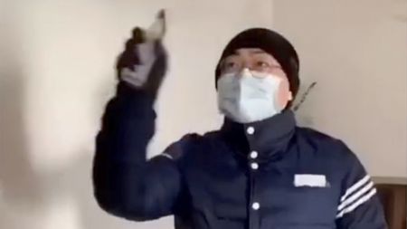 Picking up packages like a spy during coronavirus outbreak - CGTN