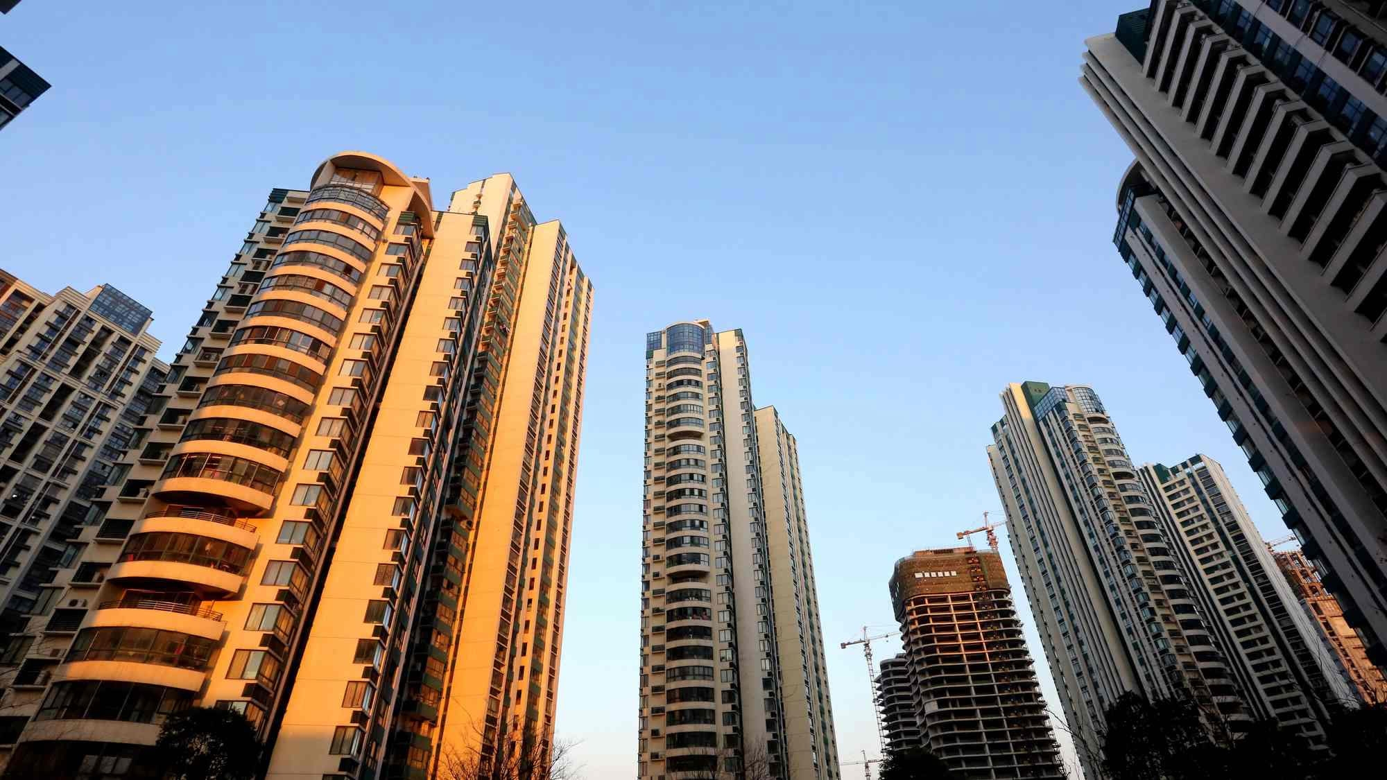 China steps up property purchase restrictions to cool buying frenzy - CGTN