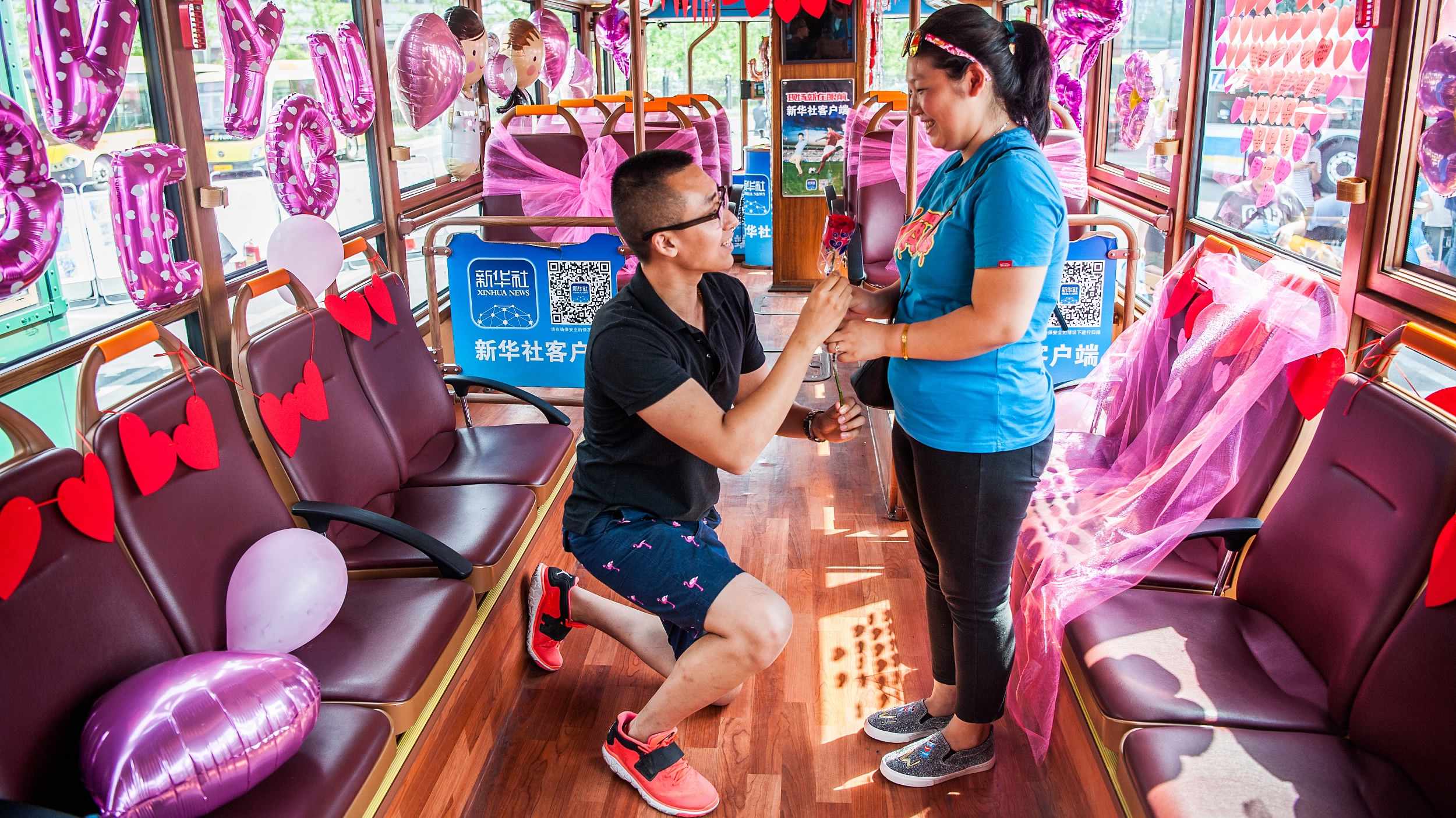 All aboard the love bus as young Beijinger proposes on retro vehicle - CGTN