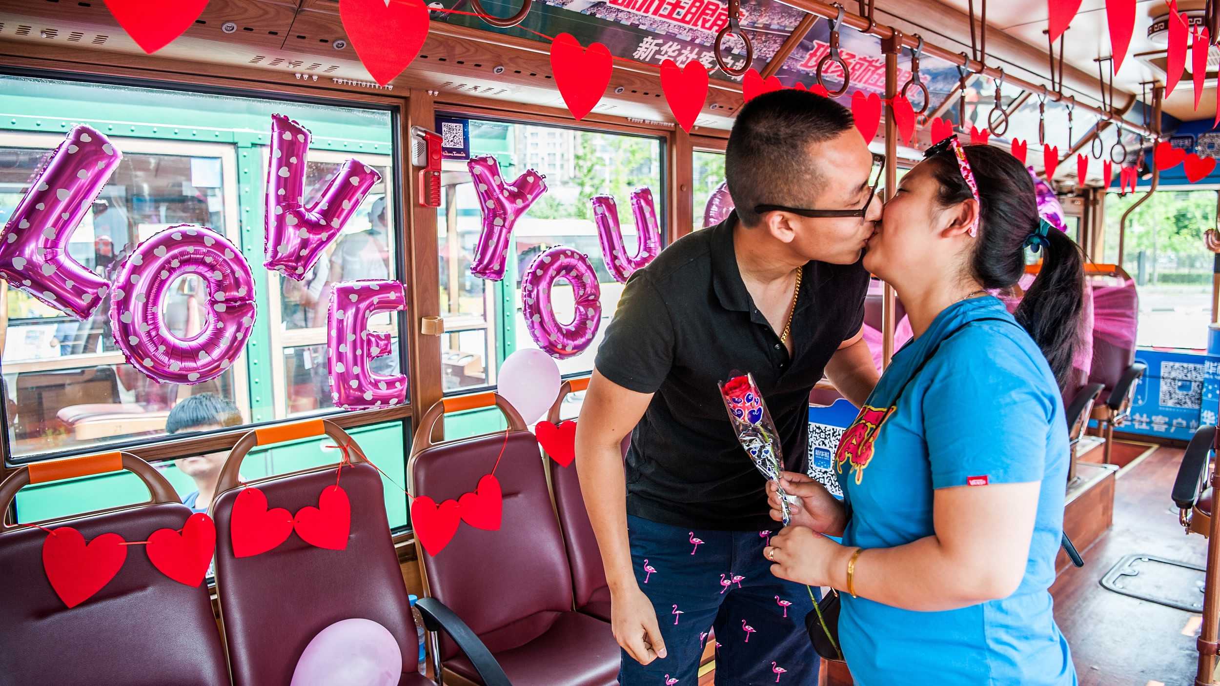 All aboard the love bus as young Beijinger proposes on retro vehicle - CGTN